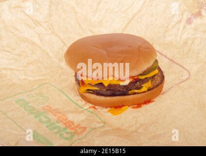 McDonald’s triple cheeseburger on wrapper Stock Photo - Alamy