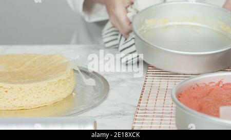 Step by step. Removing freshly baked cake layers from the cake pan to ...