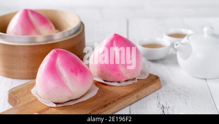 Pink Chinese peach birthday bun food named Longevity peach shoutao on ...
