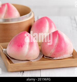 Pink Chinese peach birthday bun food named Longevity peach shoutao on ...