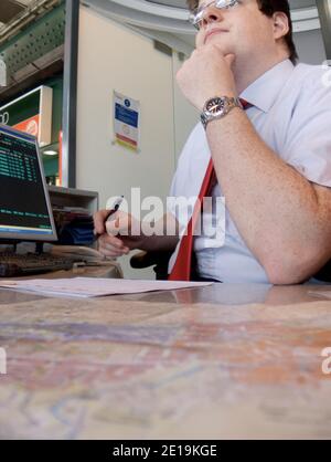 Train station help information desk and assistant Stock Photo - Alamy