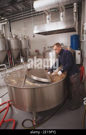 Vertical shot of beer tanks and beer production equipment at ...