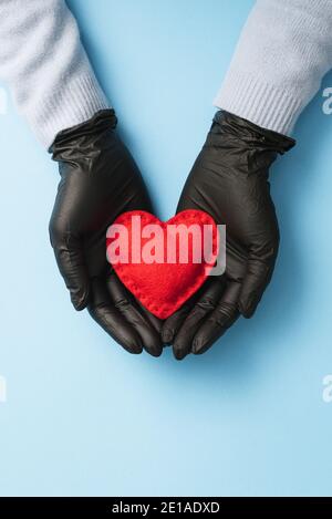 Valentine's Day in a covid-19 pandemic.latin man with protection mask ...