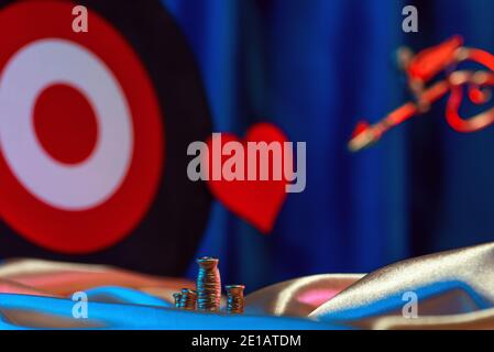 Small golden cupid marks his target with an arrow at the heart ...