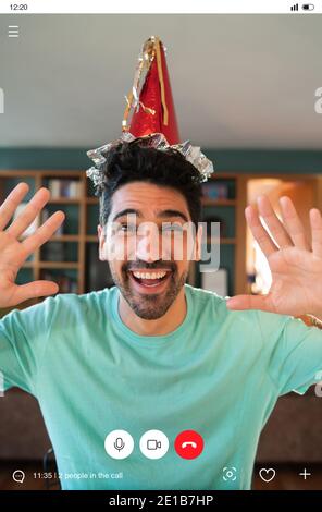 Man celebrating his birthday on a video call Stock Photo - Alamy
