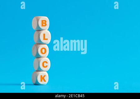 The word barrier on tiered wooden cubes with a walking stick man on ...