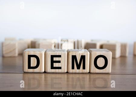 Concept word 'demo' on cubes on a beautiful wooden table. White ...