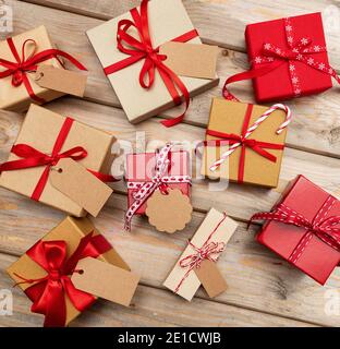 parcels boxes with kraft paper, on wooden table on grey background ...