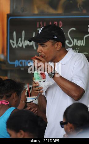 President Barack Obama enjoys shave ice with his daughter Malia Obama ...