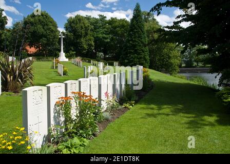 WWI Ramparts Cemetery / Lille Gate with Cross of Sacrifice and graves ...