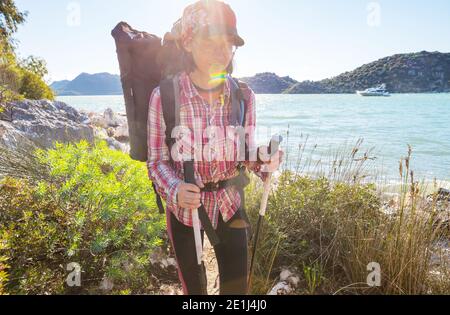 woman traveler walking by Lycian Way trail mountains in Turkey near ...