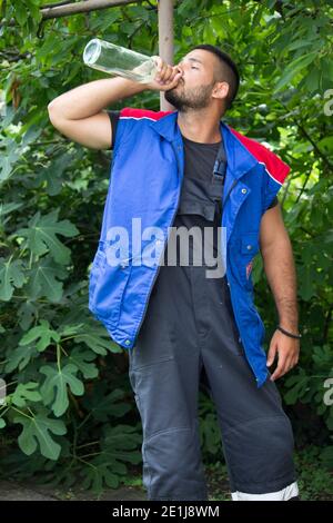 Young sad drunk men drinking beer and alcohol feeling wasted, lonely ...