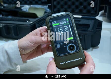 Personal military search dosimeter-radiometer for measuring levels of ...