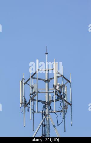 Telecommunication tower and sky with light flare Stock Photo - Alamy