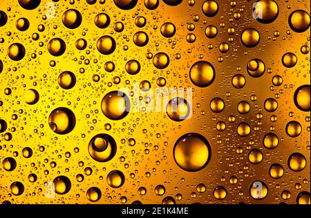 Orange fruit through drops on glass Stock Photo - Alamy