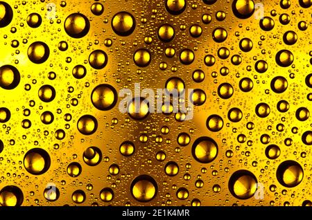 Orange fruit through drops on glass Stock Photo - Alamy