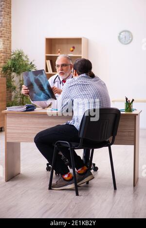 Young male patient visiting experienced doctor Stock Photo - Alamy