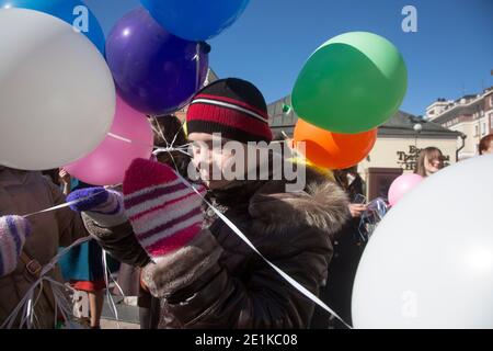 Moscow, Russia - March 8, 2016: Happy couple walking on the street ...