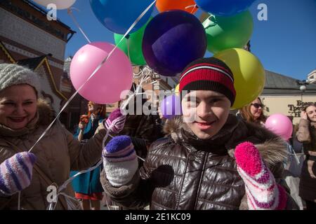 Moscow, Russia - March 8, 2016: Happy couple walking on the street ...