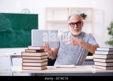 Senior male student in tele-education concept Stock Photo - Alamy
