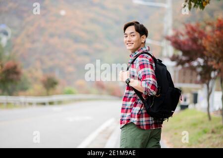 handsome Asian male model autumn travel concept Stock Photo - Alamy