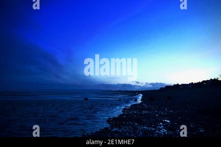 Cold beach evening blue sky night Stock Photo - Alamy
