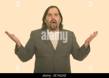 Fat Caucasian businessman looking confused and shrugging shoulders ...