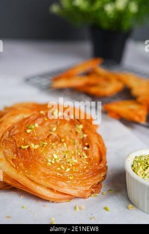 Khaja. Indian deep-fried crispy sweet snacks made of layered fritters ...