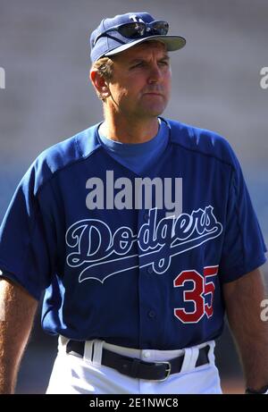Los Angeles Dodgers batting coach Mark McGwire #12 before a game against the Colorado Rockies at ...