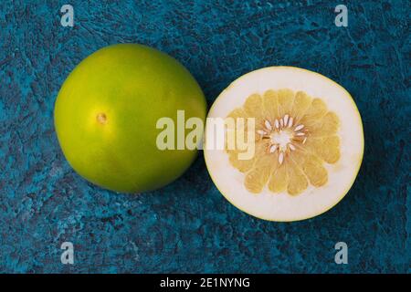 Ripe fresh Pomelo fruit over the wooden background Stock Photo - Alamy