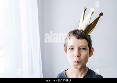 Happy autism boy wearing a toy crown and smile. Life style autism ...