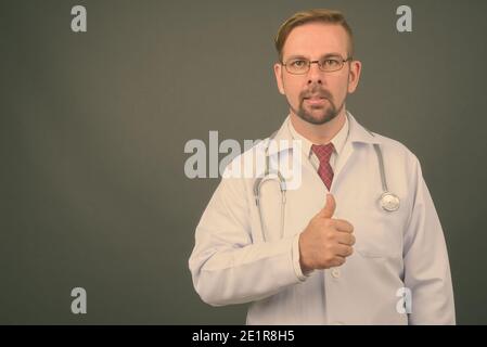 Blond bearded man doctor with goatee against gray background Stock ...