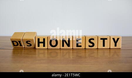 Be honest or dishonest symbol. Turned wooden cubes and changed concept ...