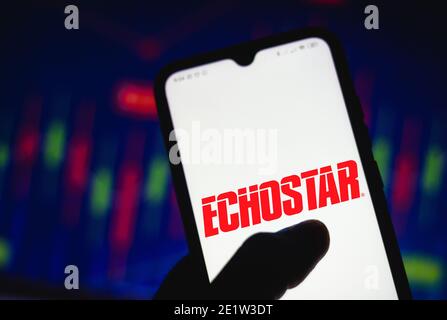 In this photo illustration the EchoStar Corporation logo seen displayed ...