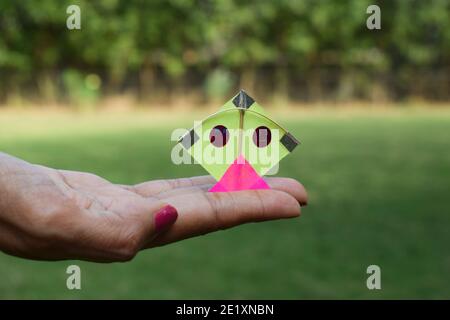 Small tiny miniature Blue color kite. Very small in size female holding ...