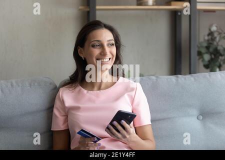 E-commerce Concept. Happy Arab Woman Holding Credit Card And Talking On ...