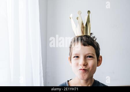 Happy autism boy wearing a toy crown and smile. Life style autism ...