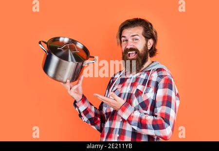 try this one. non-stick surface. chef cooking dinner. mature guy in ...