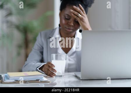 Businesswoman employee sick in the office Stock Photo - Alamy