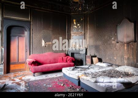 Creepy derelict bedroom in an old abandoned house, vintage coulor cross ...