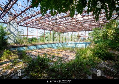 Derelict building indoors with abandoned swimming pool like Chernobyl ...