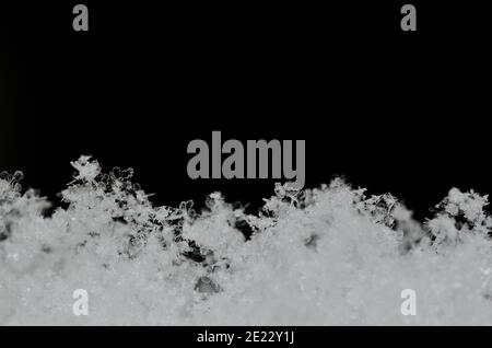 fragile white snow crystals with black background Stock Photo - Alamy