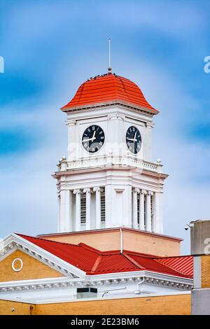 A vertical shot of an old building with blue doors and a balcony Stock ...