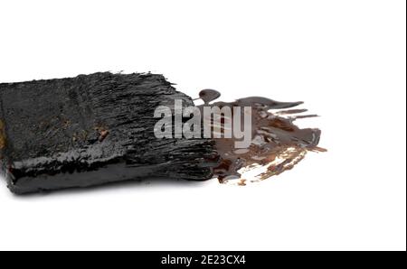 Liquid tar puddle isolated on white background Stock Photo - Alamy