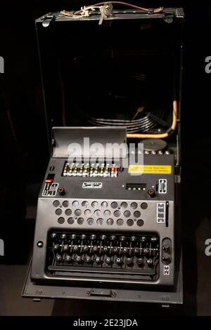 An Enigma machine rotor on display showing the internal wiring in ...