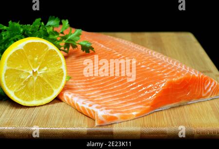 Fresh fillet salmon fish on wooden board Stock Photo - Alamy