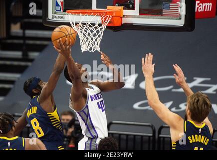 Indiana Pacers forward Justin Holiday (8) chases down a loose ball ...