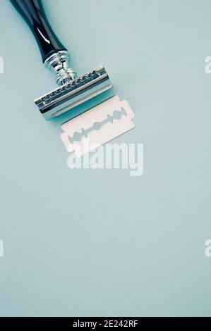 Top view of a mechanical razor and blade isolated on yellow background ...