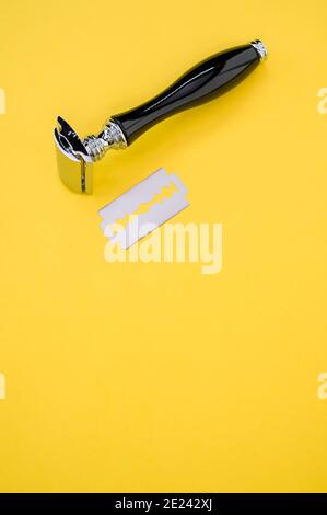 Top view of mechanical razor and blade isolated on light green ...