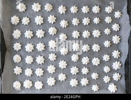 Baking sheet with meringue in oven Stock Photo - Alamy